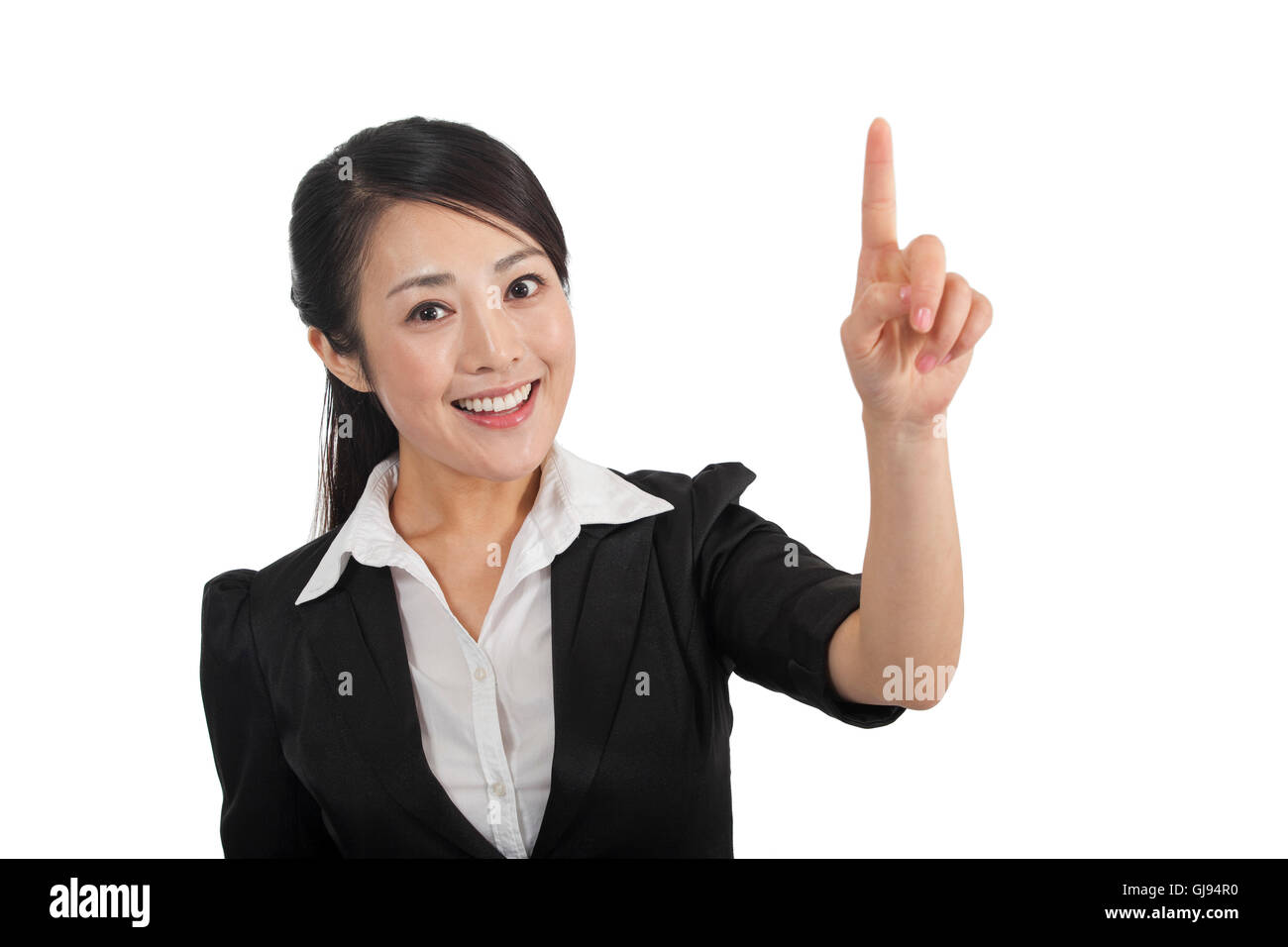 Business lady pointing studio shot Stock Photo - Alamy