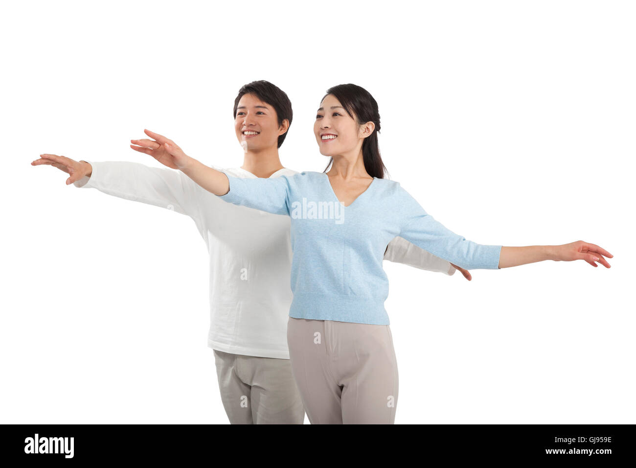 Studio shot casual couple dancing Stock Photo - Alamy
