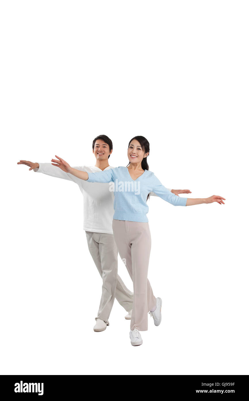 Studio shot casual couple dancing Stock Photo - Alamy