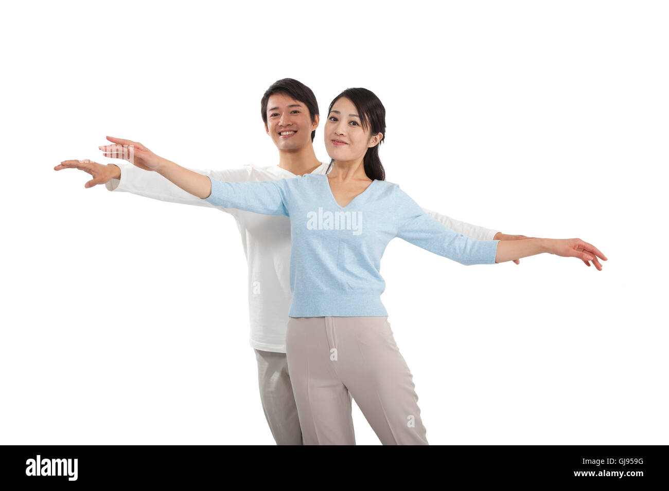 Studio shot casual couple dancing Stock Photo - Alamy
