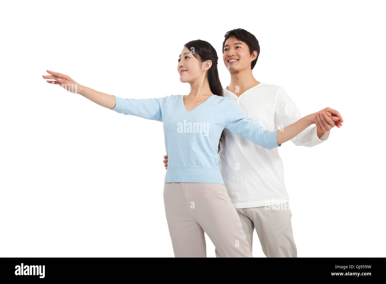 Studio shot casual couple dancing Stock Photo - Alamy