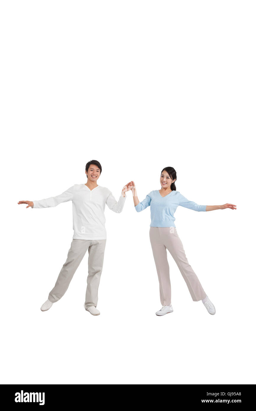 Studio shot casual couple dancing Stock Photo - Alamy