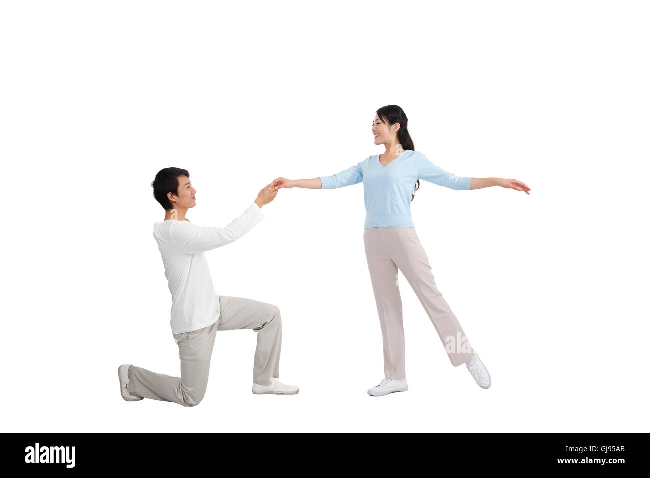 Studio shot casual couple dancing Stock Photo - Alamy