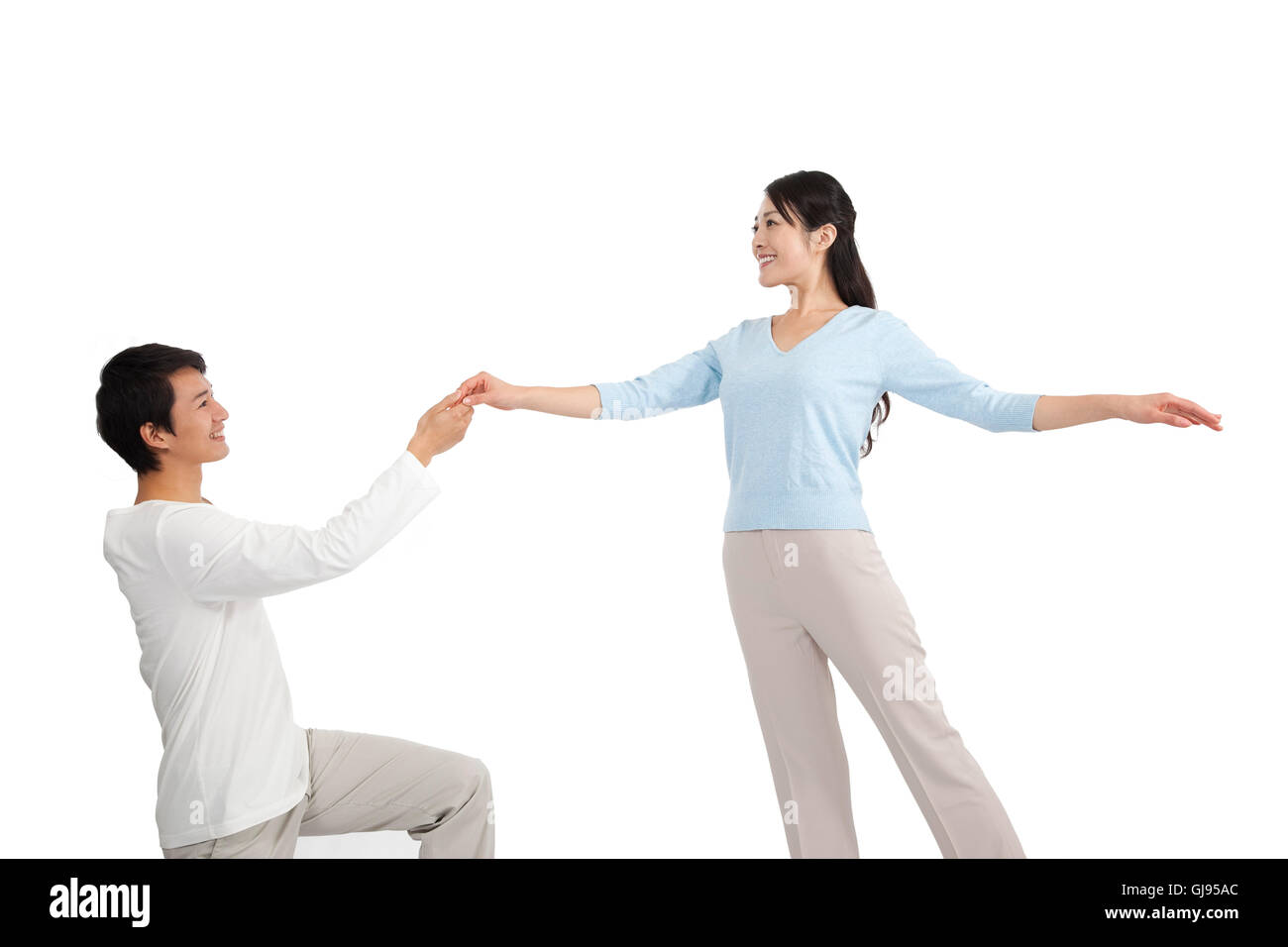 Studio shot casual couple dancing Stock Photo - Alamy