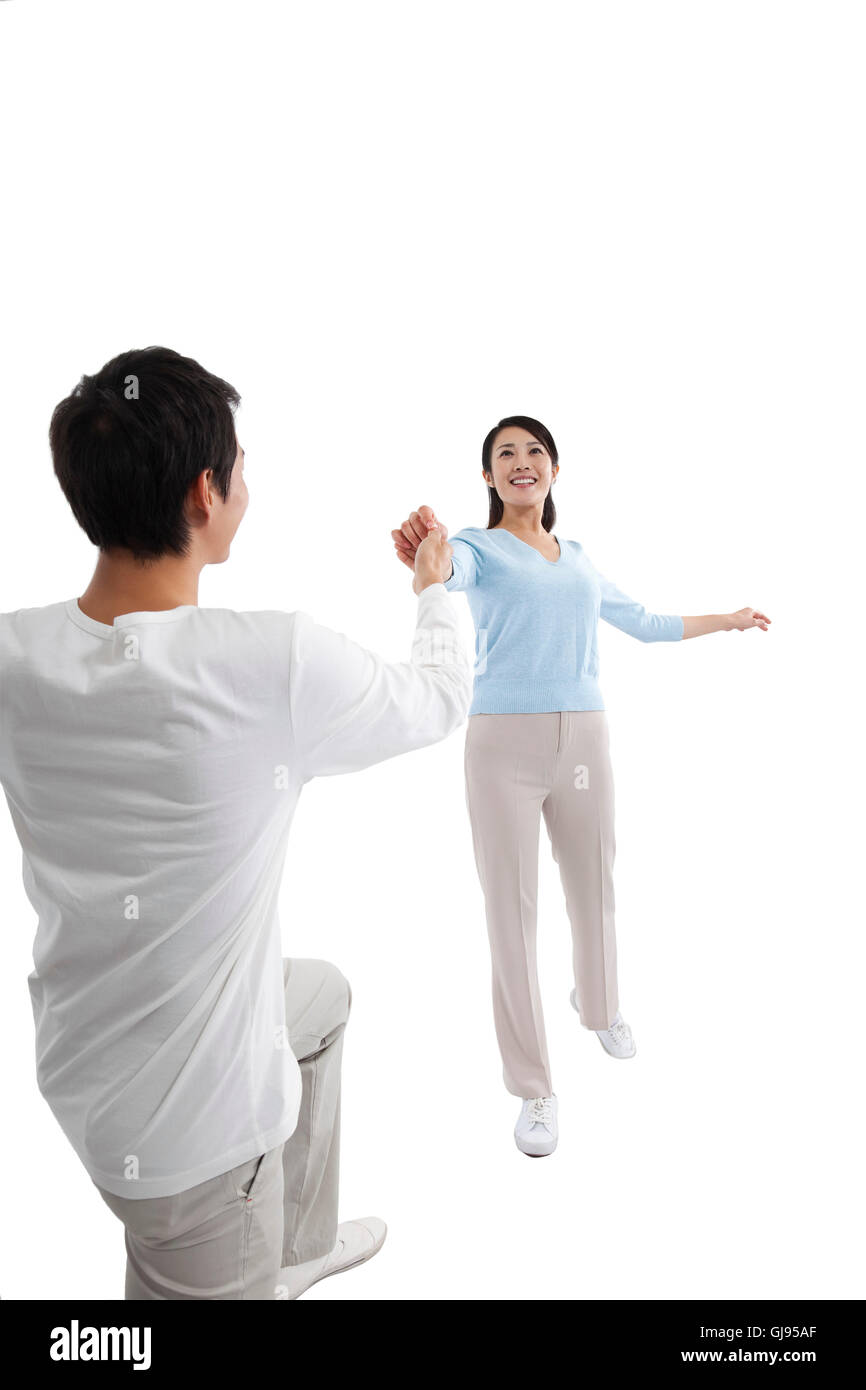 Studio shot casual couple dancing Stock Photo - Alamy