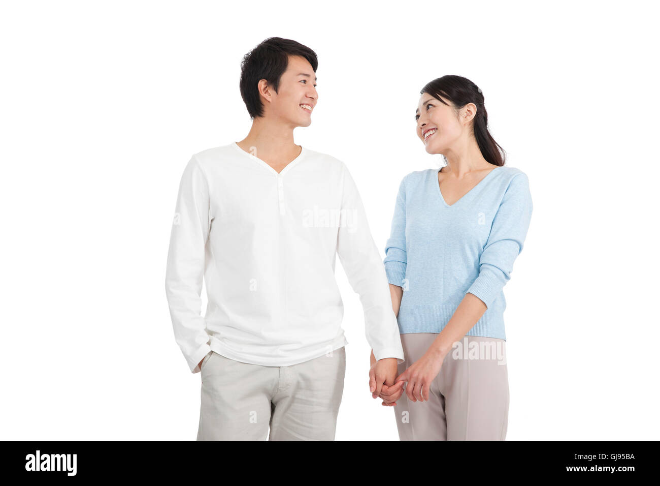 Studio shot casual couple Handle Stock Photo - Alamy