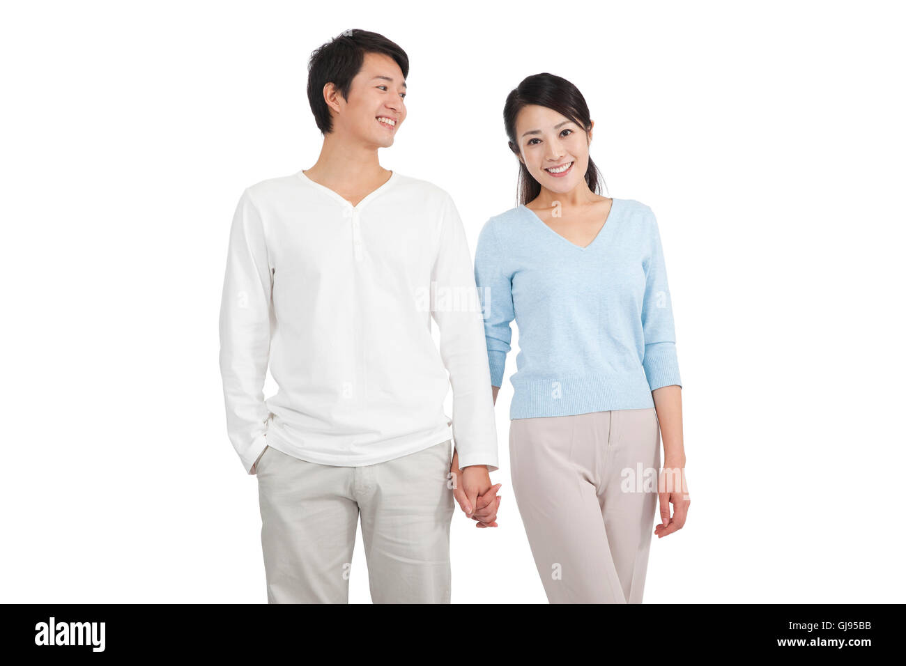 Studio shot casual couple Handle Stock Photo - Alamy