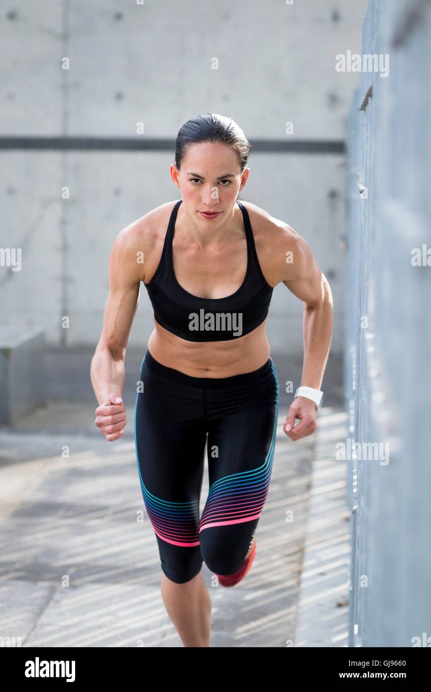 MODEL RELEASED. Young woman running towards camera Stock Photo - Alamy