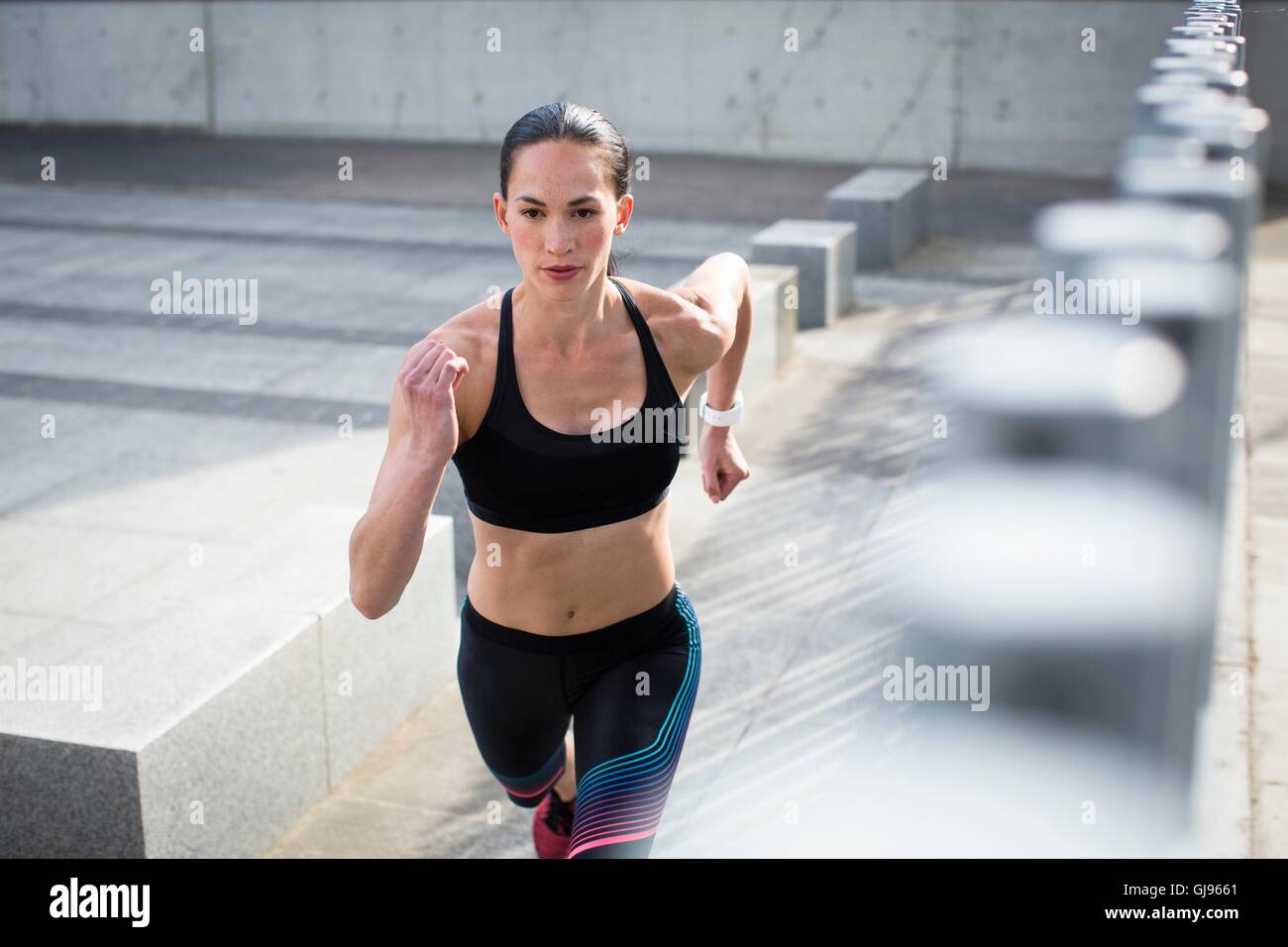 MODEL RELEASED. Young woman running towards camera Stock Photo - Alamy