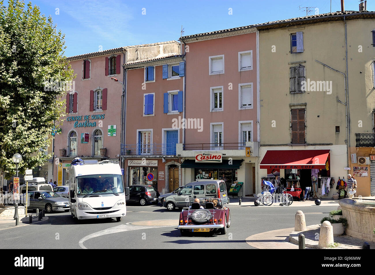 The main street of Anduze crossing the always bustling village in the ...