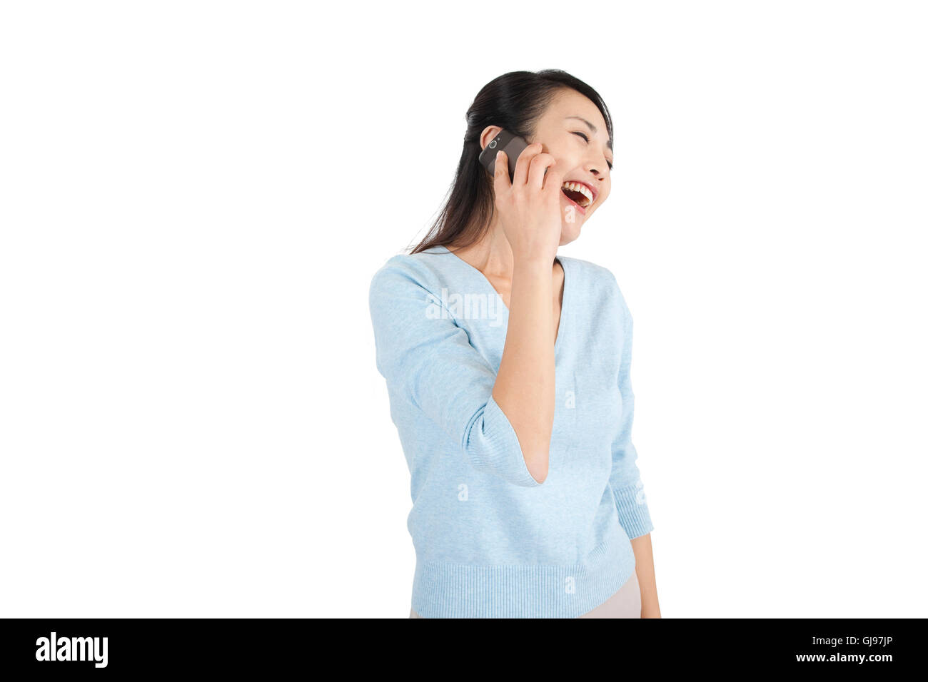 Young woman studio shot casual call Stock Photo - Alamy