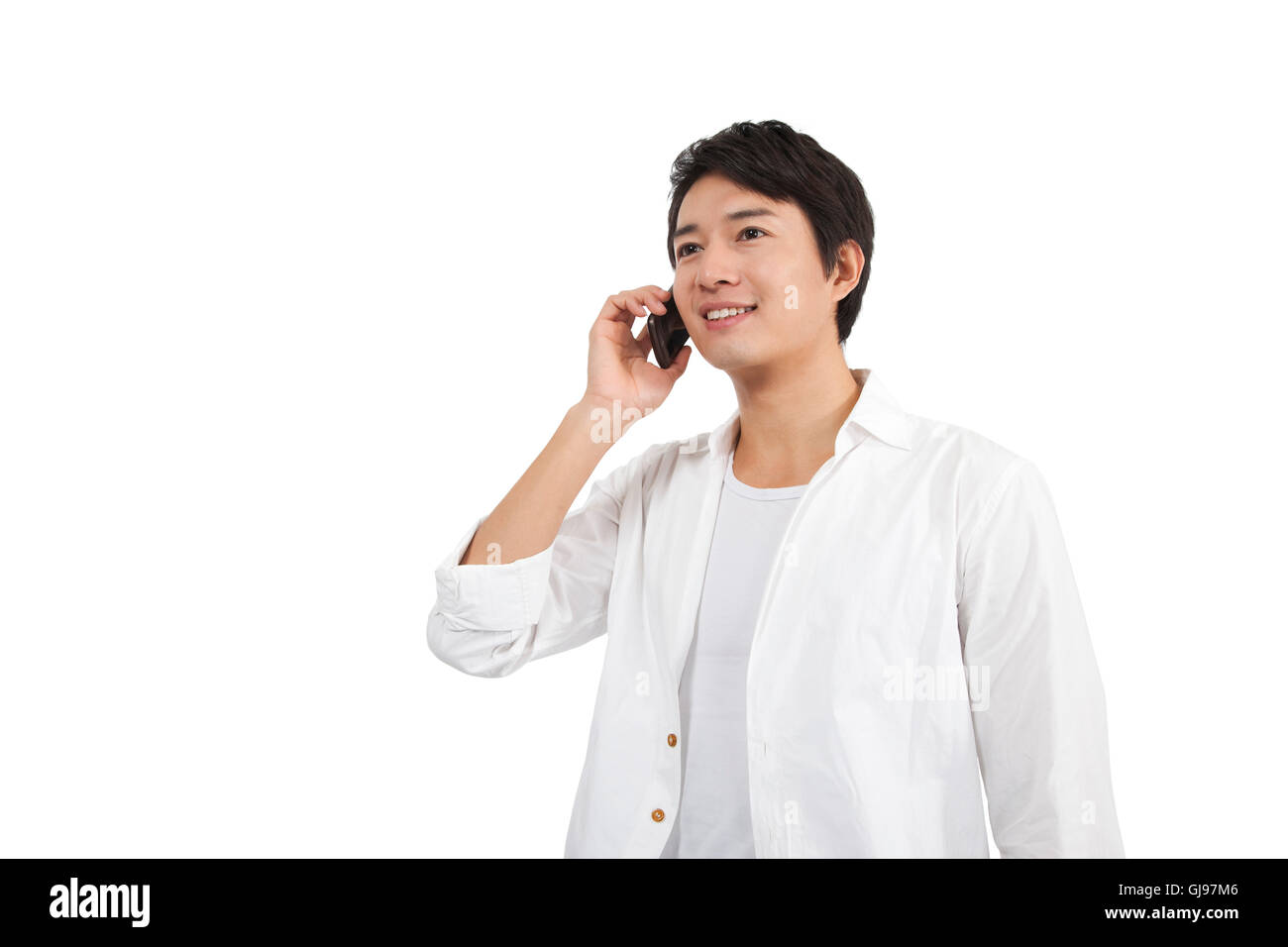 Studio shot Young casual man calling Stock Photo - Alamy