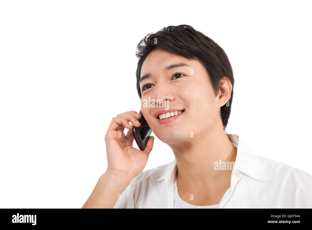 Studio shot Young casual man calling Stock Photo - Alamy