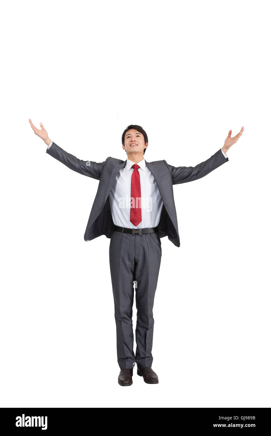 Studio shot business attire Young man with open arms Stock Photo - Alamy