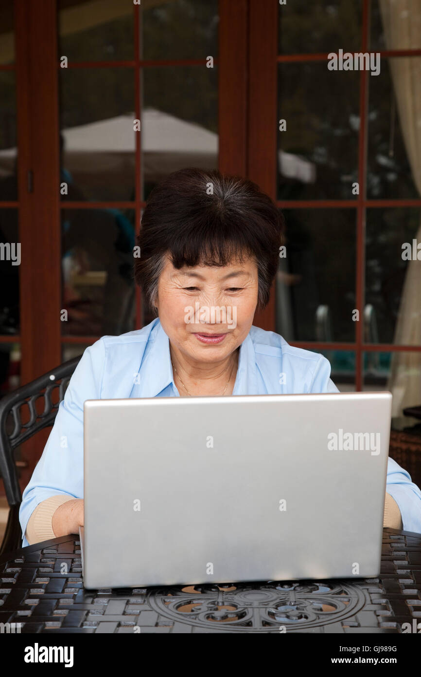 Old woman at resort hotel Internet Stock Photo - Alamy