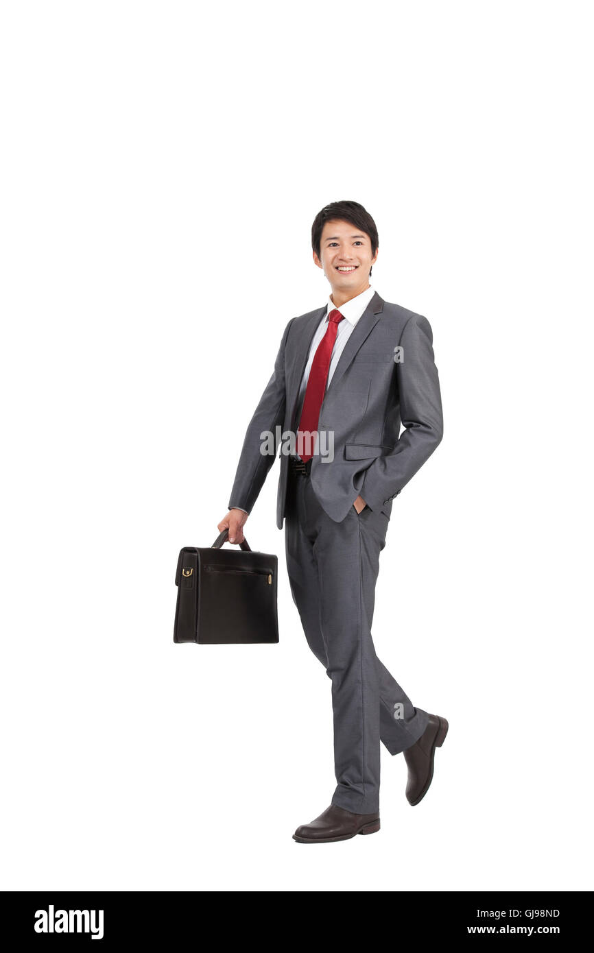 Studio shot business attire Young men carry a briefcase walking Stock ...