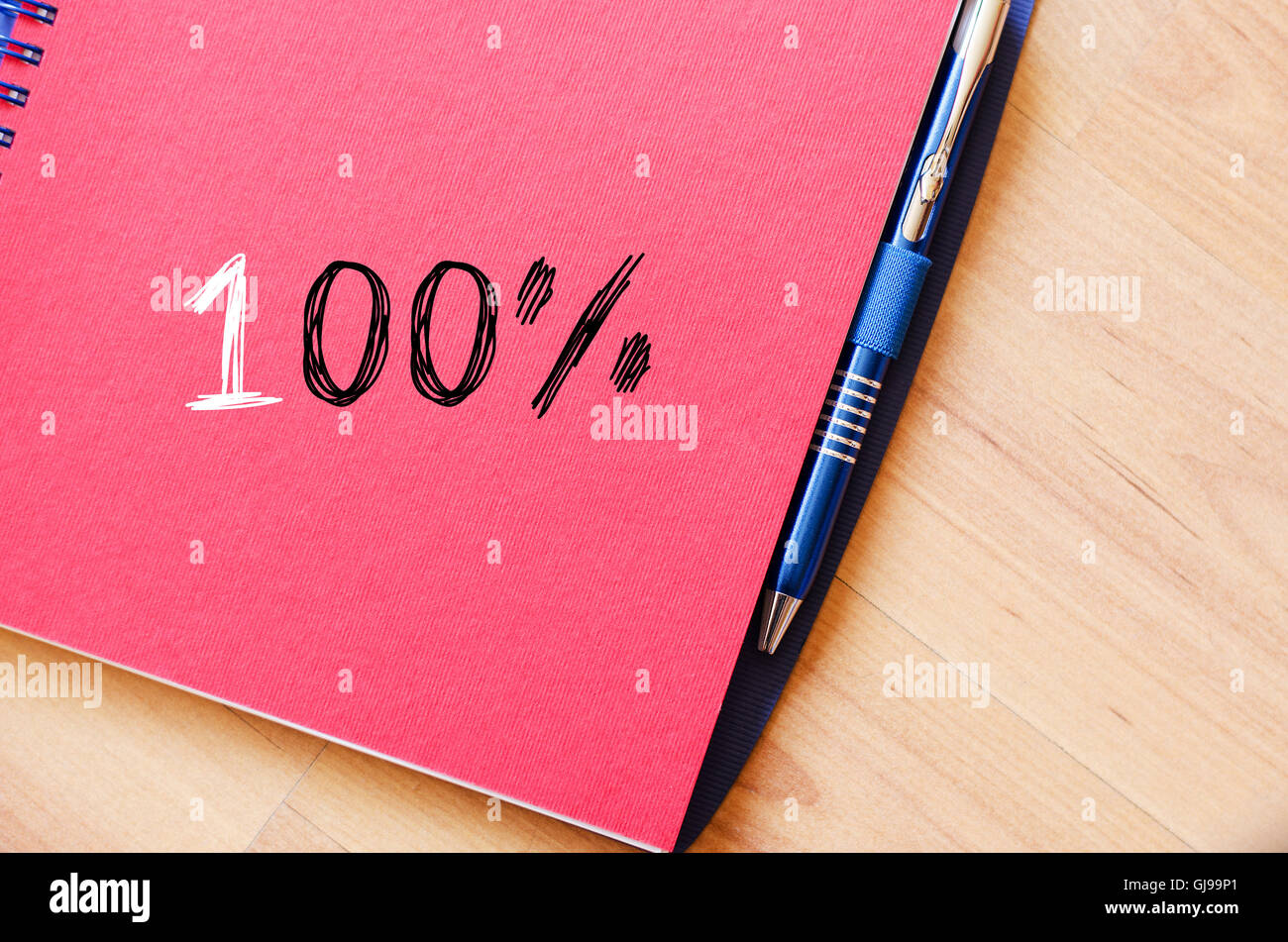 One hundred percent symbol text concept write on notebook Stock Photo ...