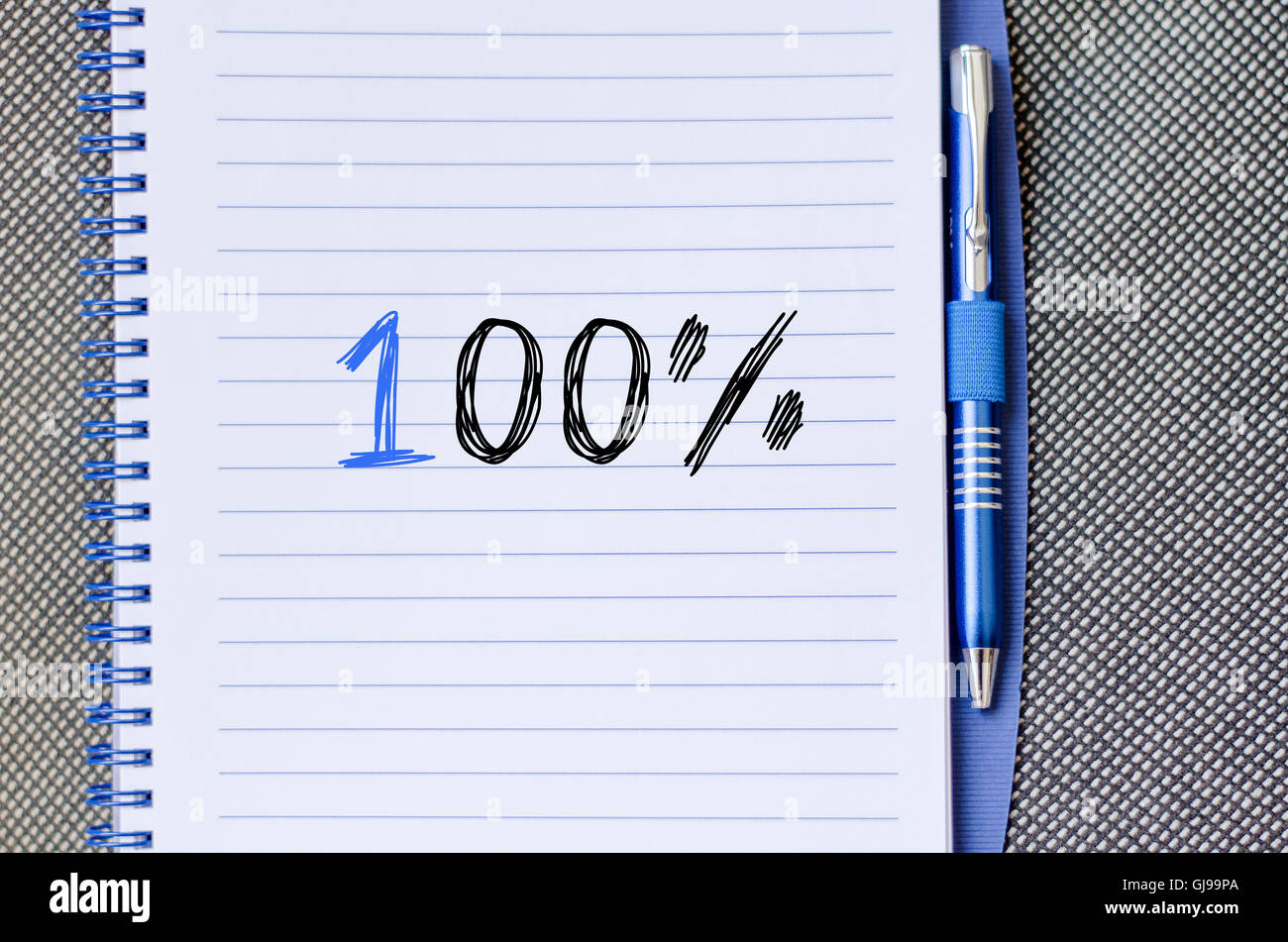 One hundred percent symbol text concept write on notebook Stock Photo ...