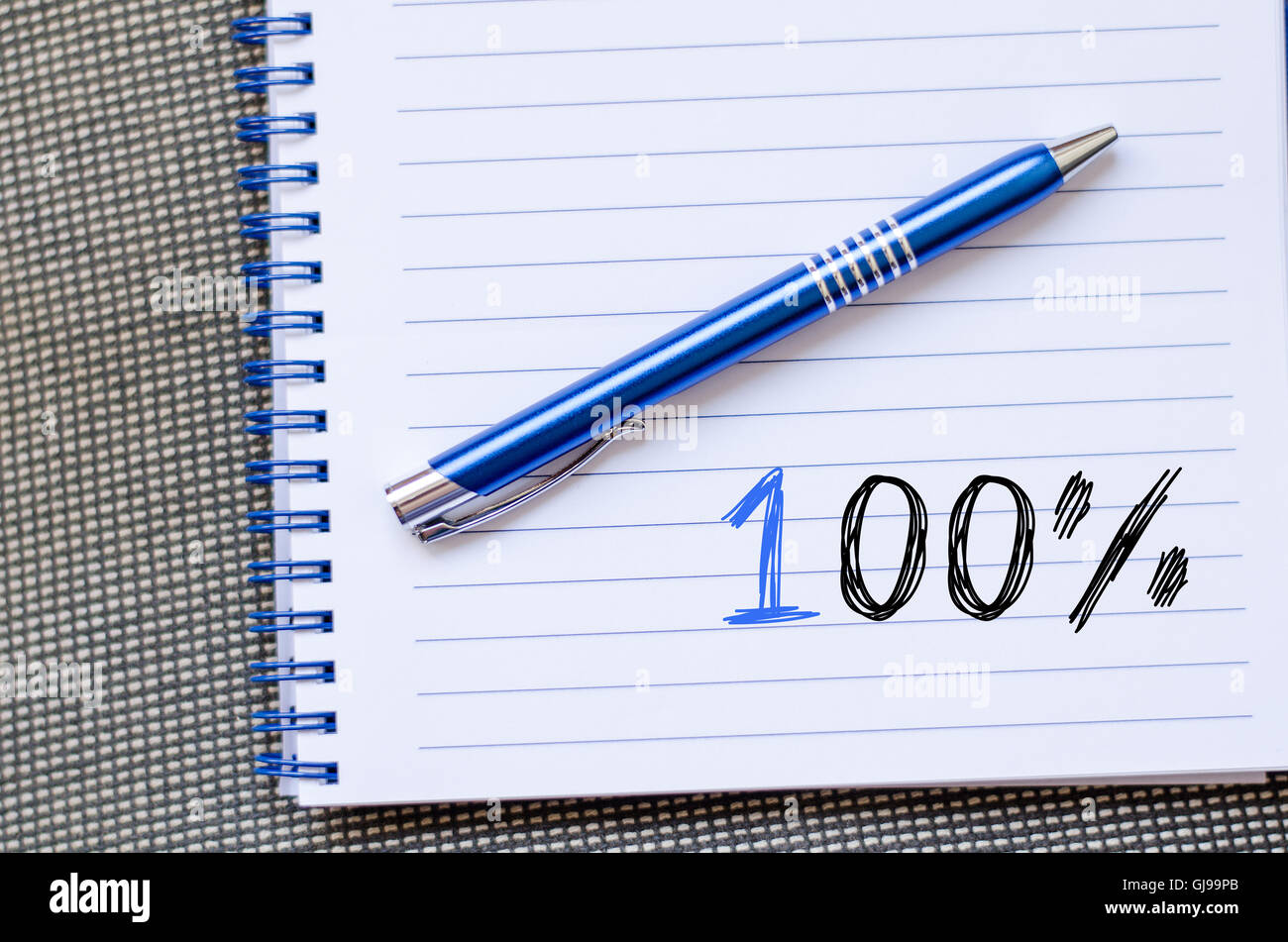 One hundred percent symbol text concept write on notebook Stock Photo ...