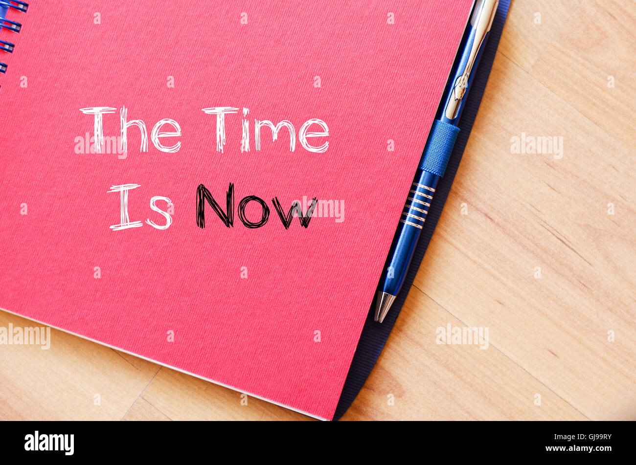 The time is now text concept write on notebook Stock Photo - Alamy