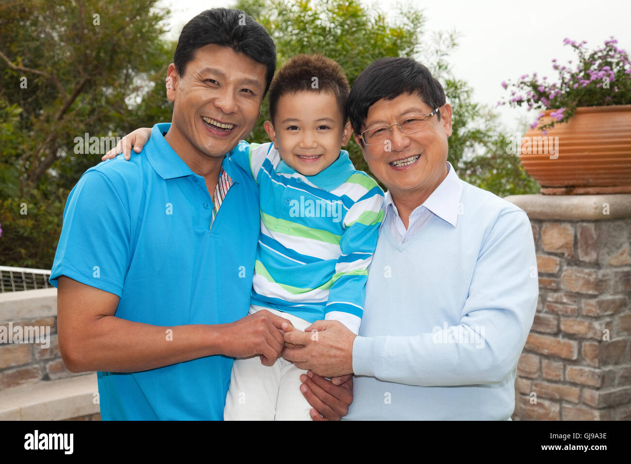 Grandfather Sun three generations at the seaside Hotel resort Stock ...