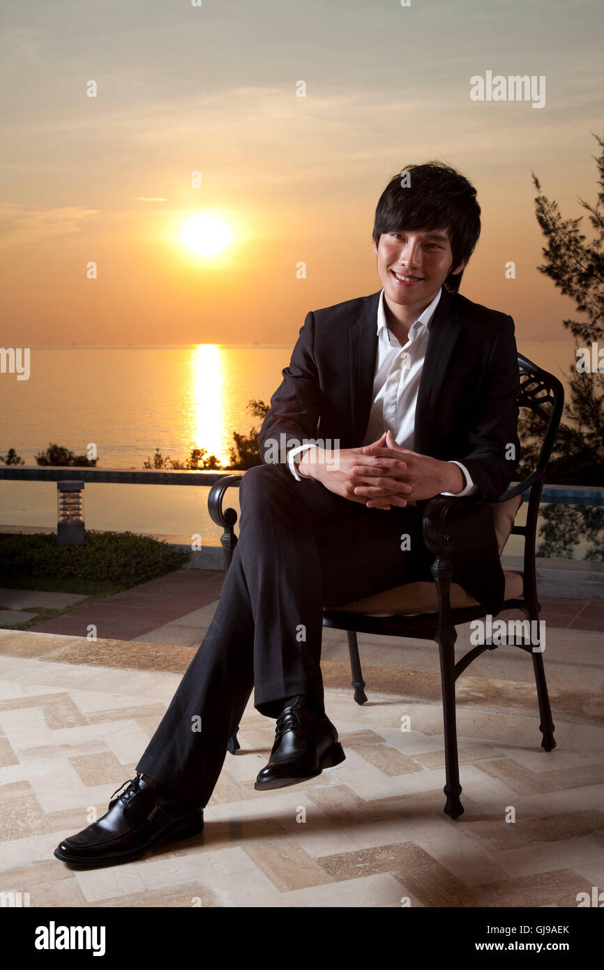 Young man in hotel Stock Photo - Alamy