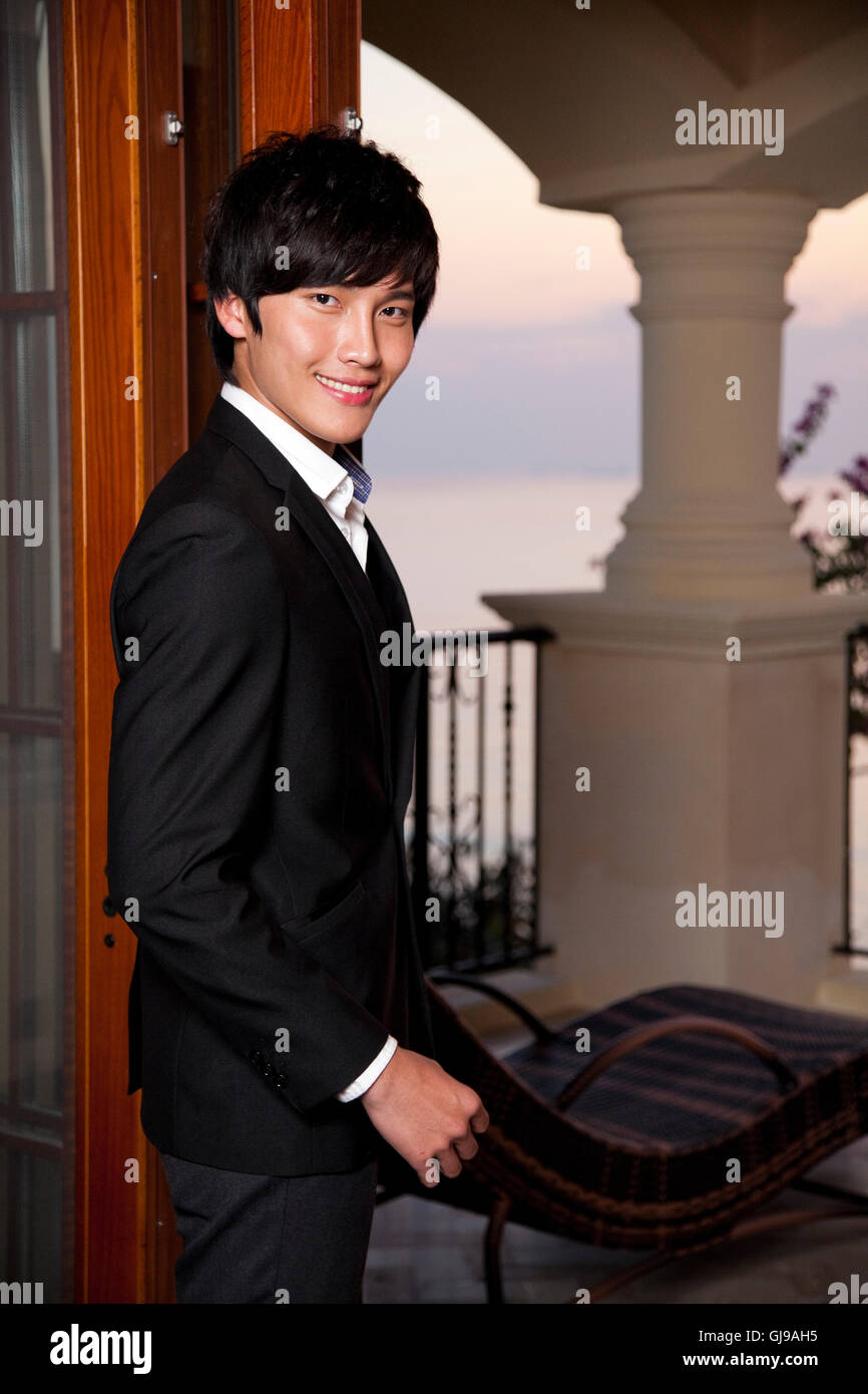 Young man in hotel Stock Photo - Alamy