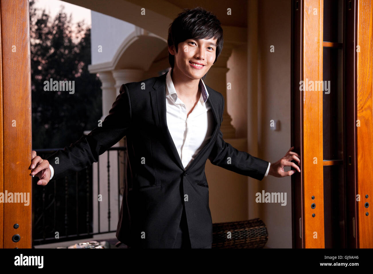 Young man in hotel Stock Photo - Alamy