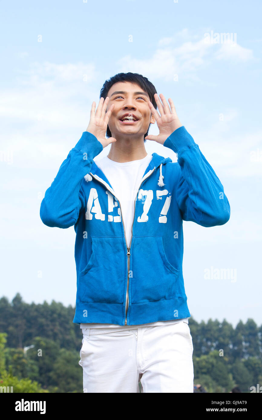 Young man shouting Stock Photo - Alamy
