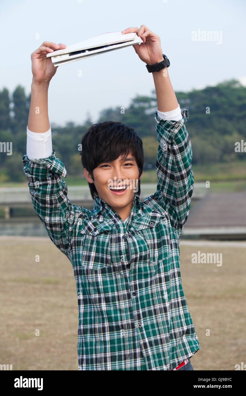 Young college students in a park outing Stock Photo - Alamy