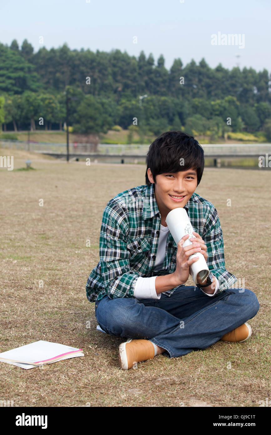 Young college students in a park outing Stock Photo - Alamy