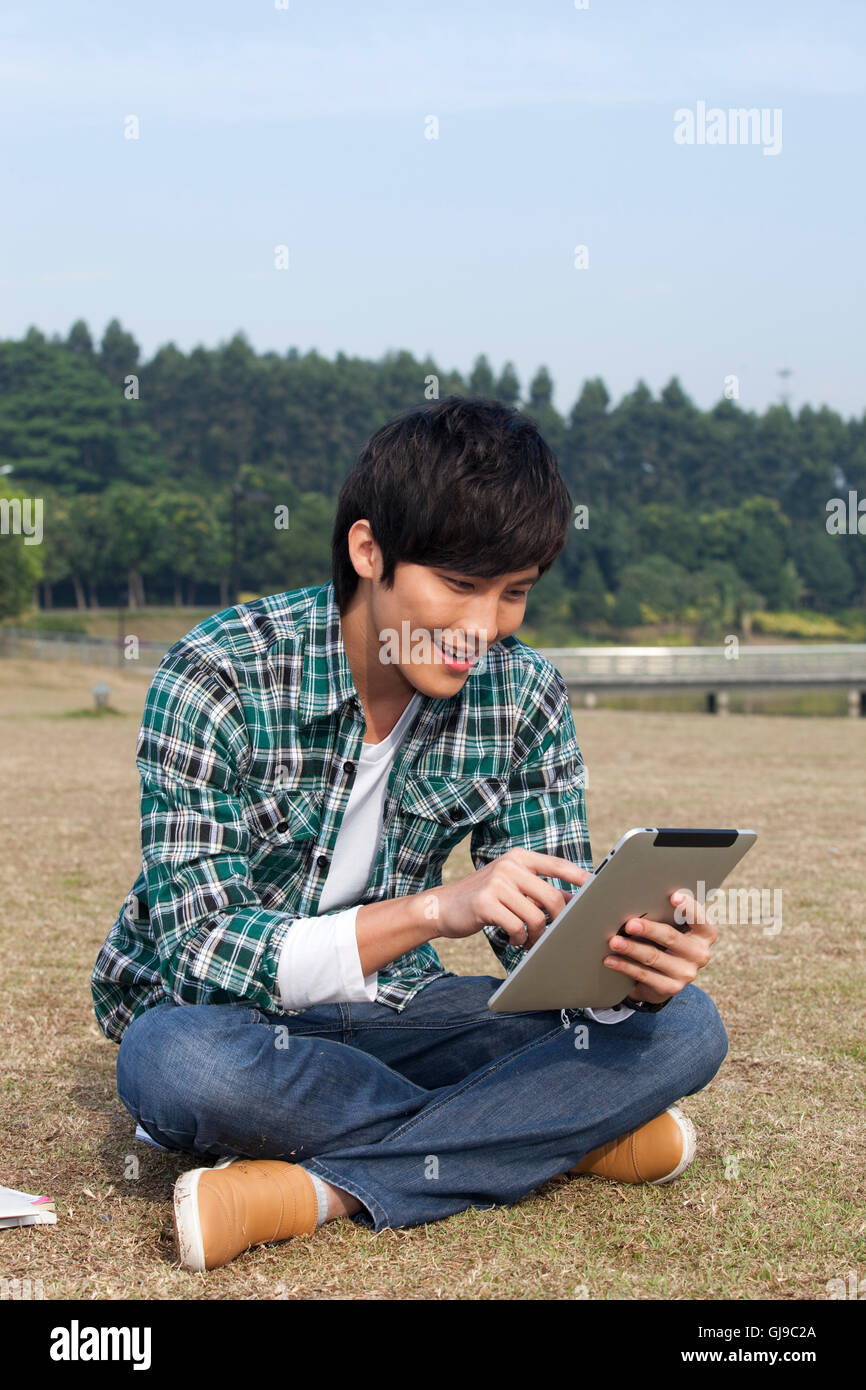 Young college students in a park outing Stock Photo - Alamy