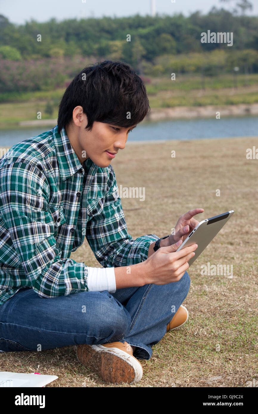Young college students in a park outing Stock Photo - Alamy