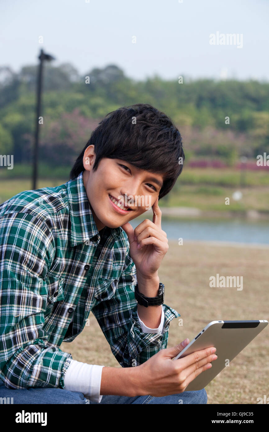 Young college students in a park outing Stock Photo - Alamy