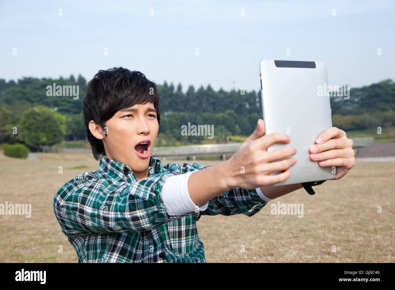 Young college students in a park outing Stock Photo - Alamy
