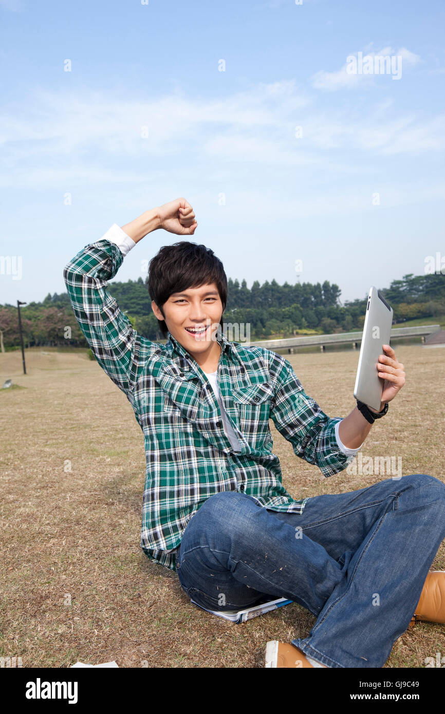 Young college students in a park outing Stock Photo - Alamy