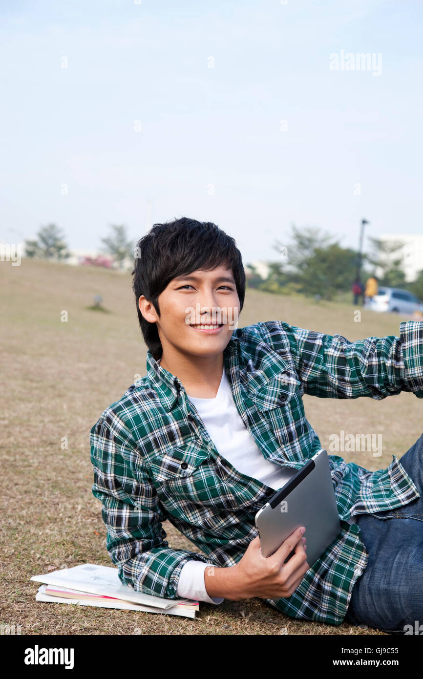 Young college students in a park outing Stock Photo - Alamy