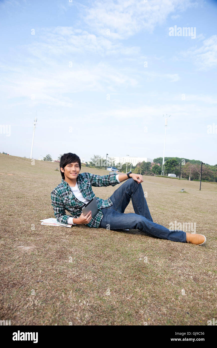 Young college students in a park outing Stock Photo - Alamy
