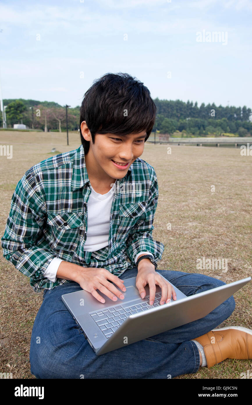 Young college students in a park outing Stock Photo - Alamy
