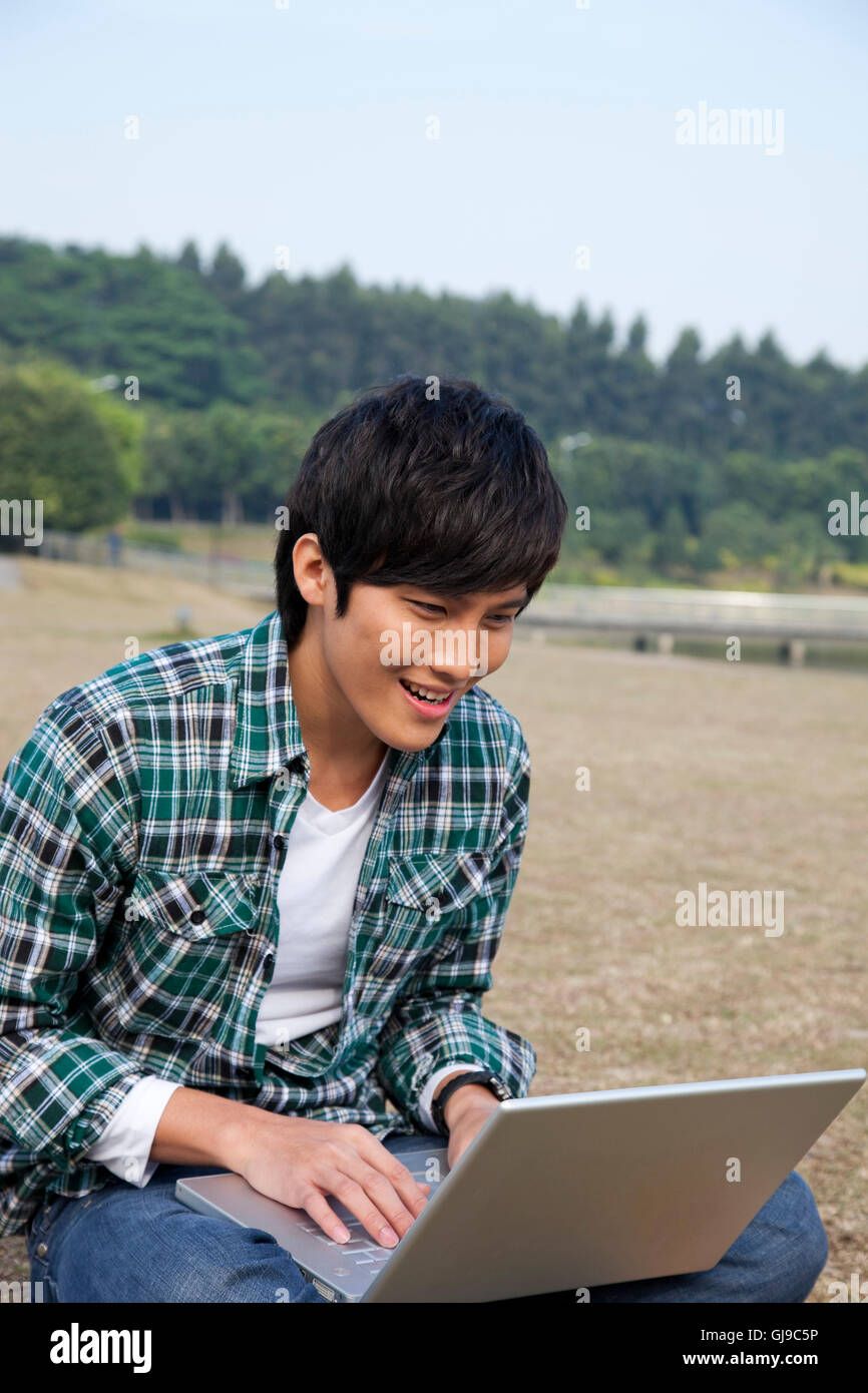 Young college students in a park outing Stock Photo - Alamy