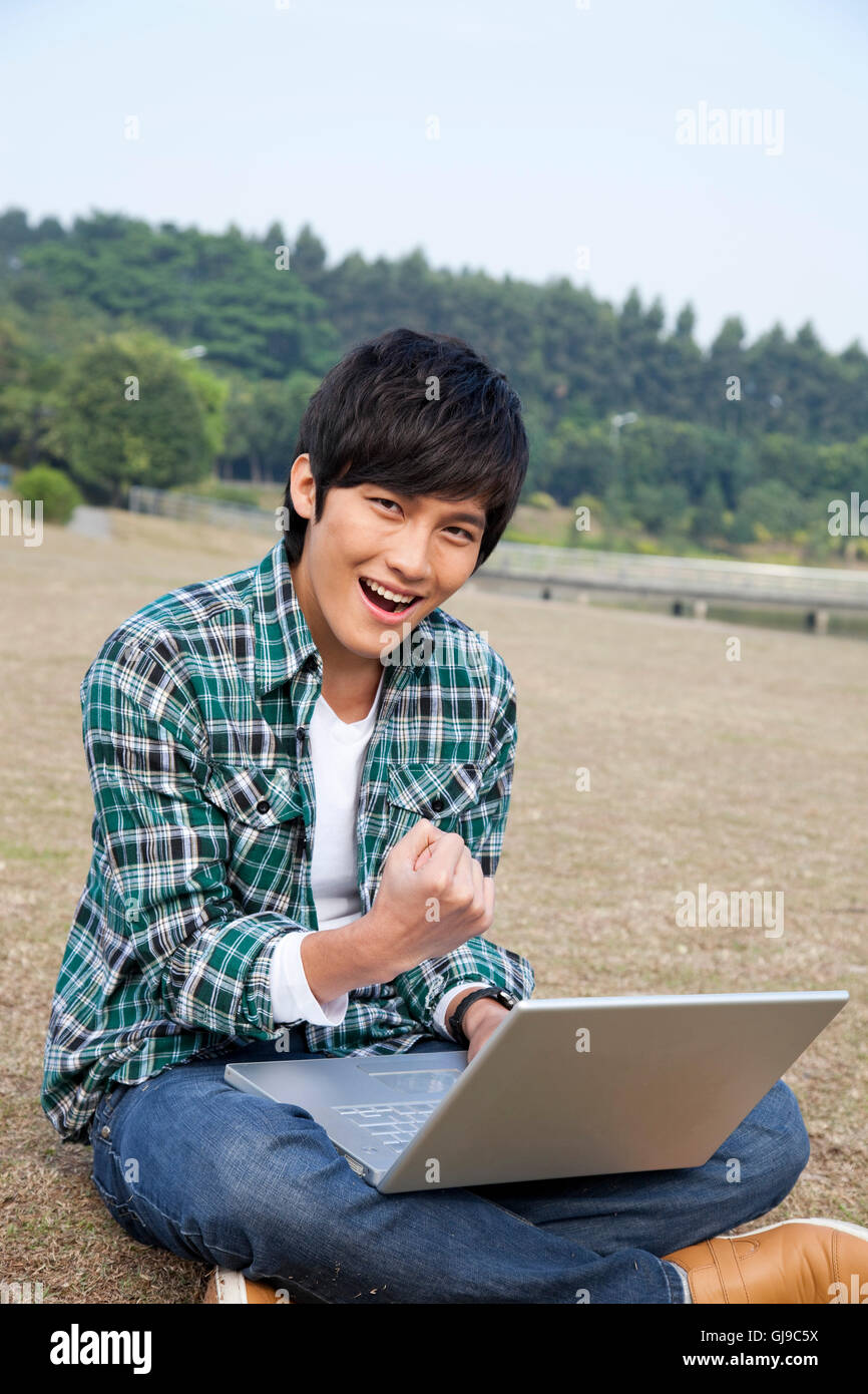 Young college students in a park outing Stock Photo - Alamy