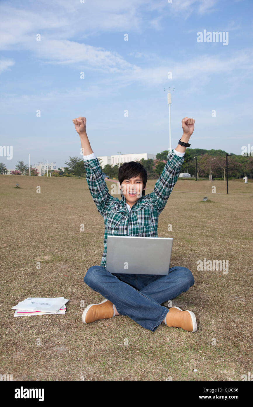 Young college students in a park outing Stock Photo - Alamy