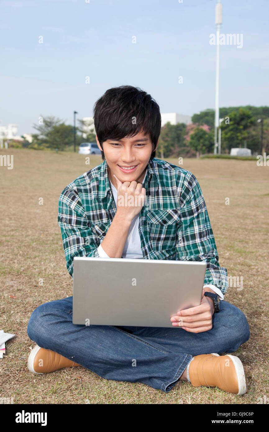 Young college students in a park outing Stock Photo - Alamy