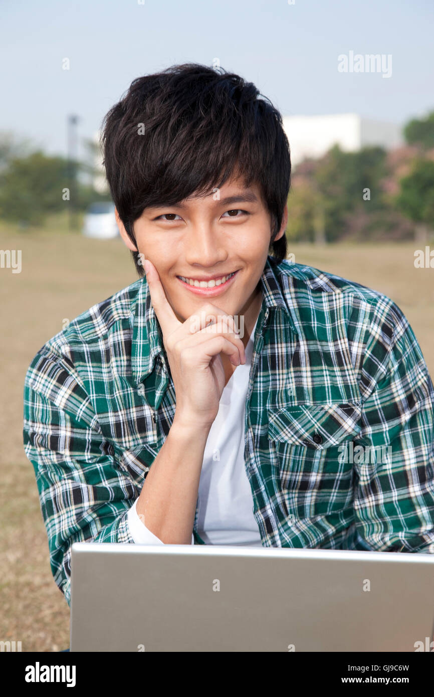 Young college students in a park outing Stock Photo - Alamy