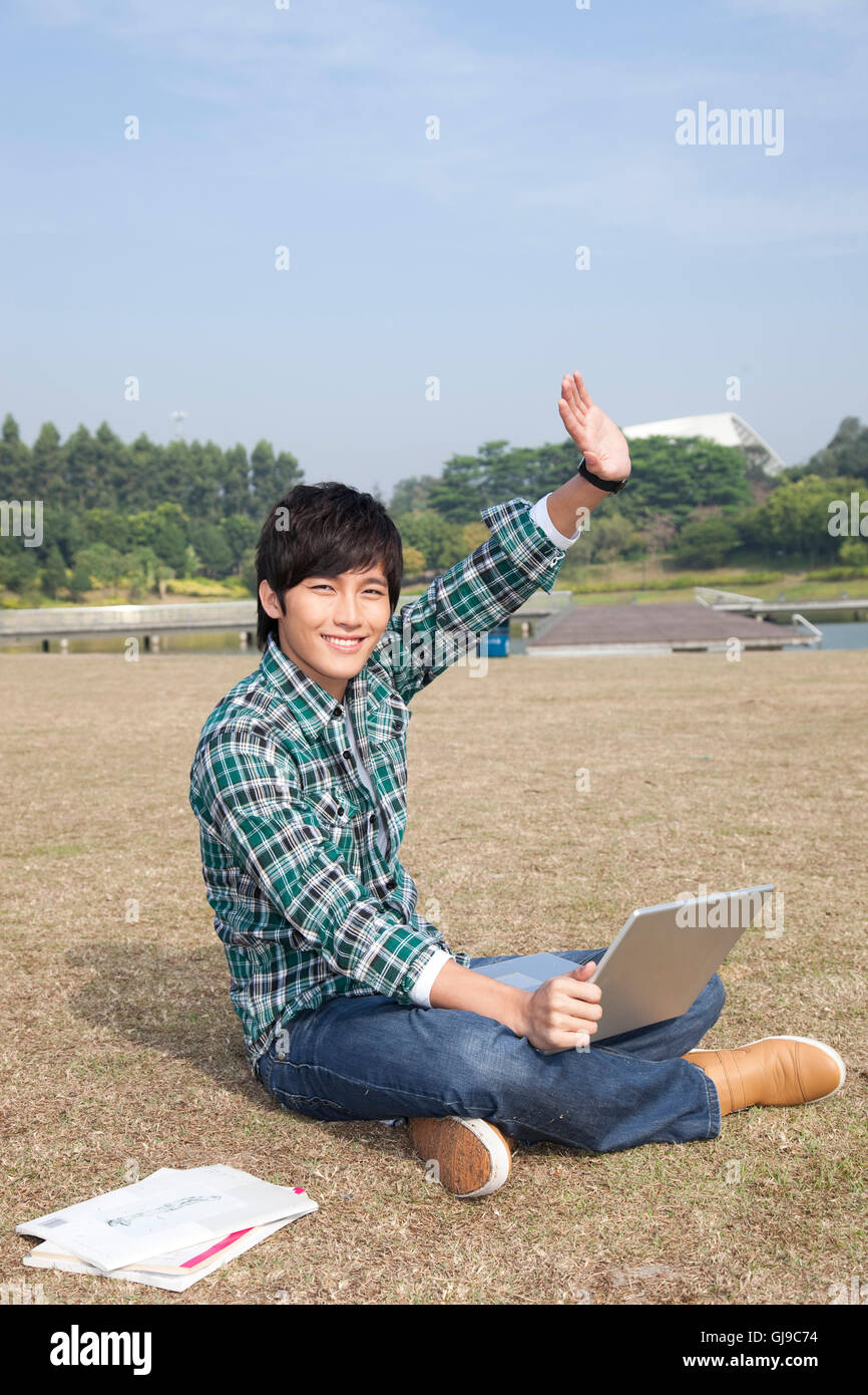 Young college students in a park outing Stock Photo - Alamy