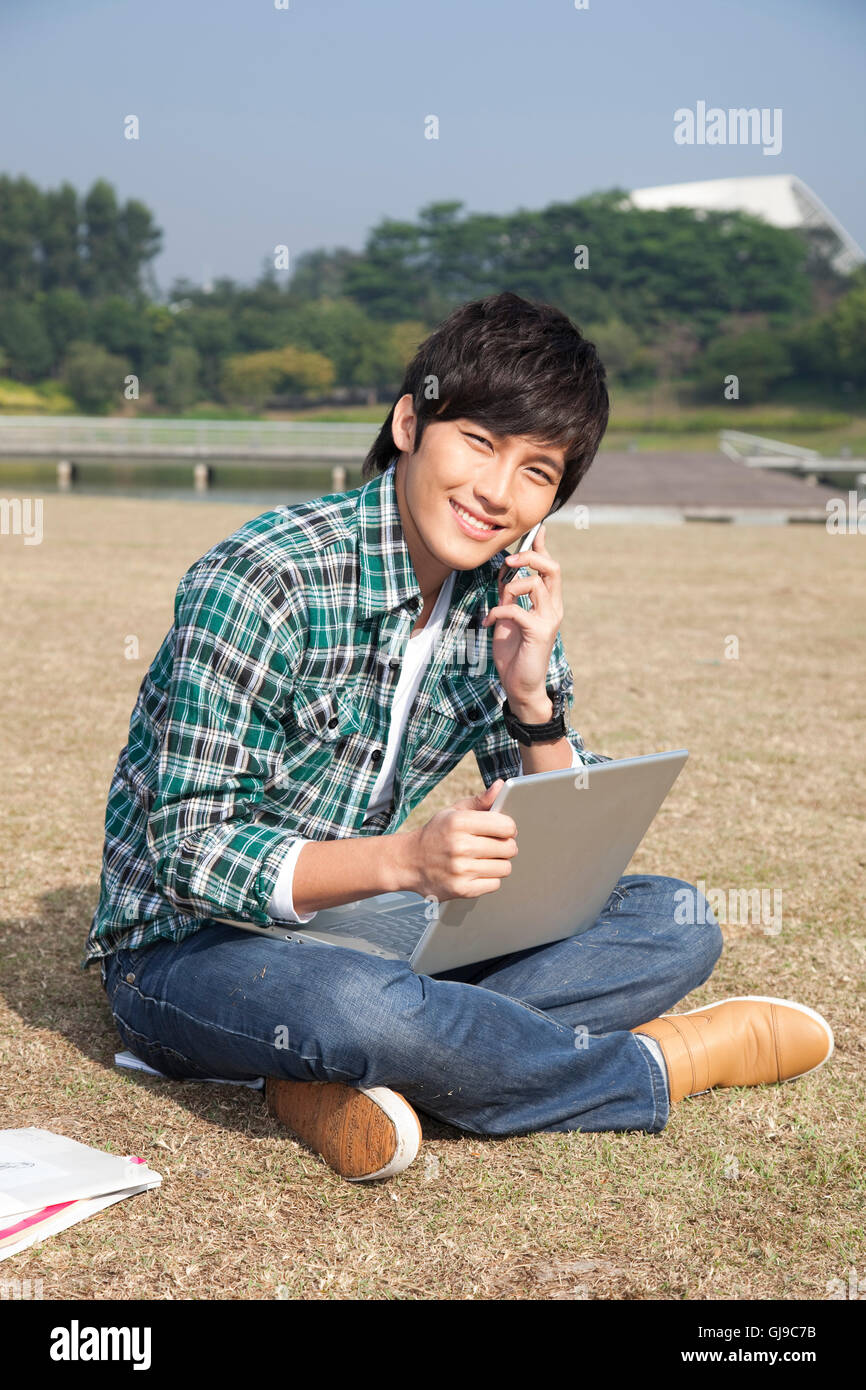 Young college students in a park outing Stock Photo - Alamy