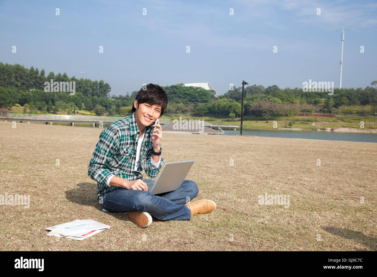 Young college students in a park outing Stock Photo - Alamy