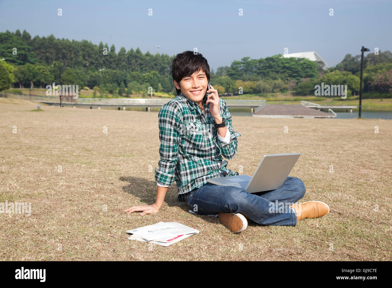Young college students in a park outing Stock Photo - Alamy