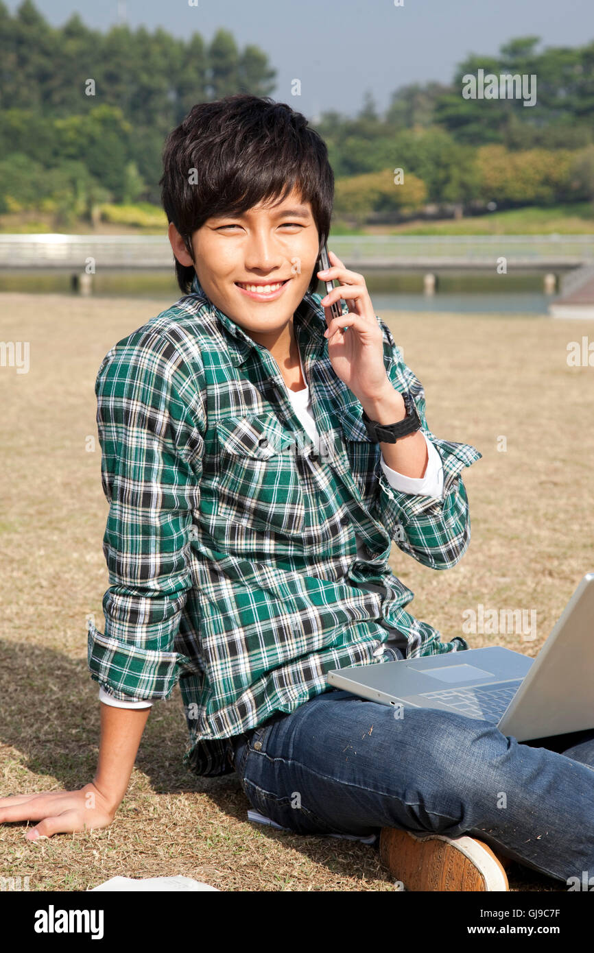 Young college students in a park outing Stock Photo - Alamy