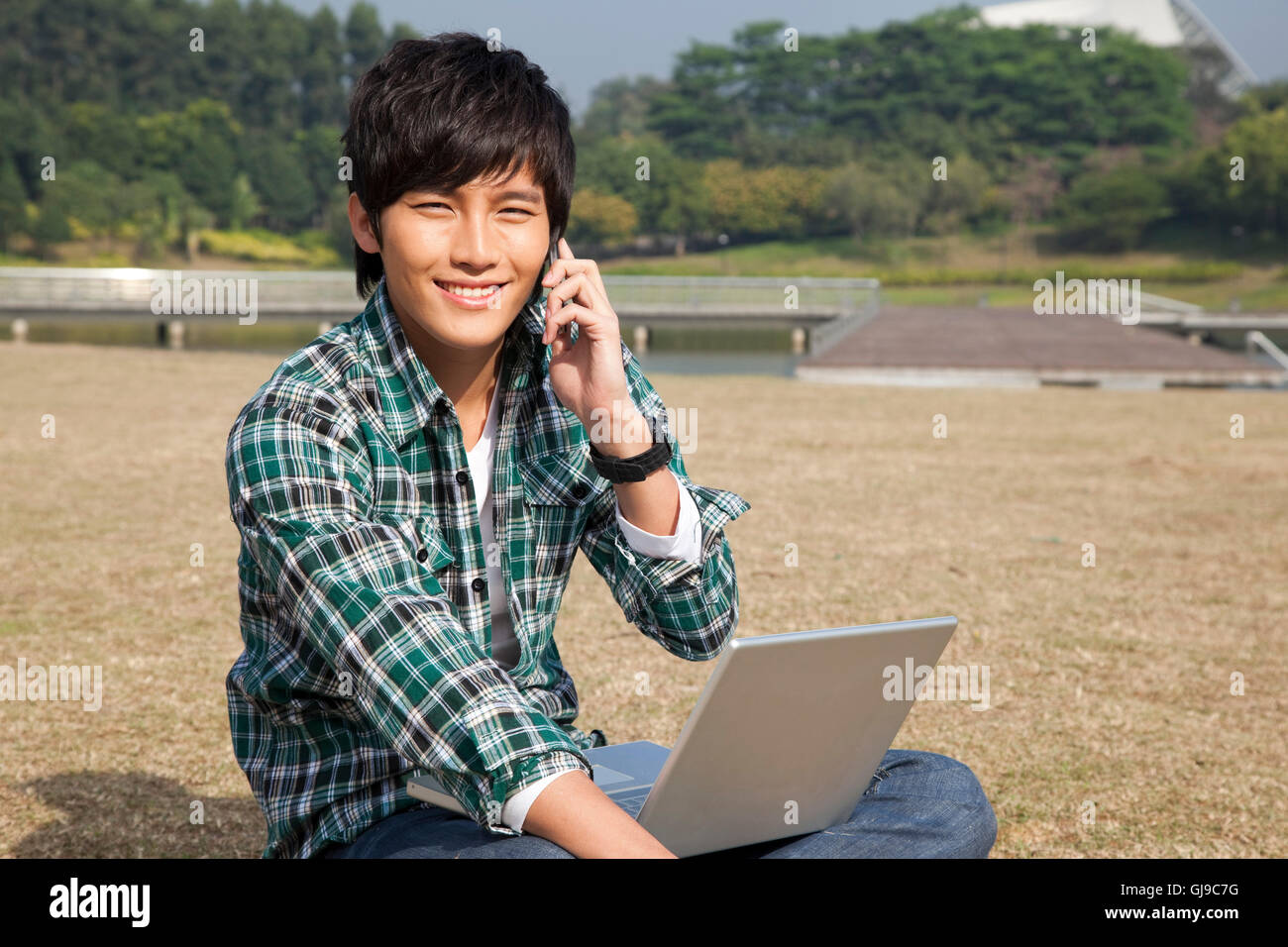 Young college students in a park outing Stock Photo - Alamy